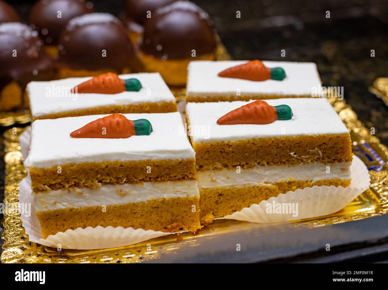 Delicious fresh baked colorful decorated cakes, tarts with cream and ...