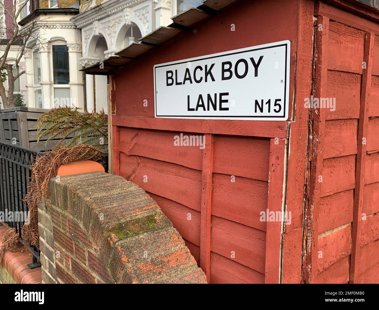 A Black Boy Lane sign on a shed in La Rose Lane in north London, which ...