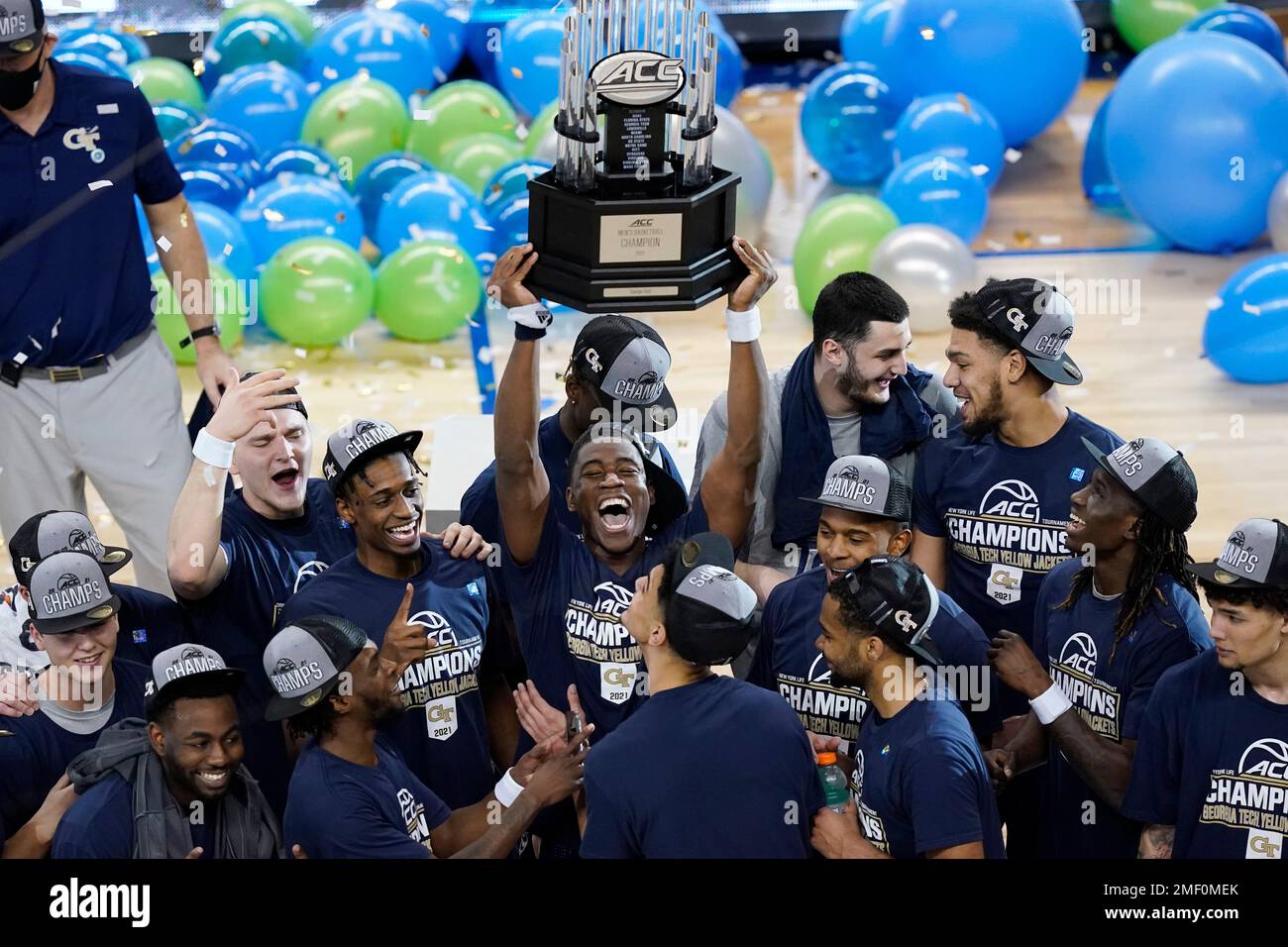 Georgia Tech players hold the trophy as they celebrate their 80-75 win ...