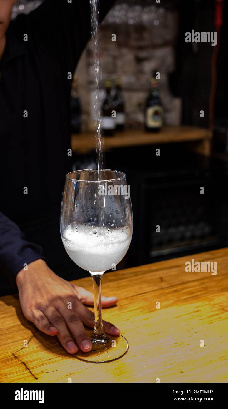Pouring of txakoli or chacolí slightly sparkling very dry white wine ...