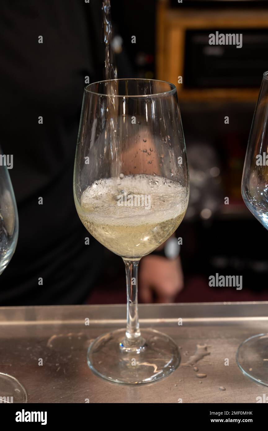 Pouring of txakoli or chacolí slightly sparkling very dry white wine ...