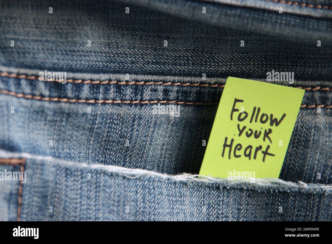 Follow your Heart concept Motivational quotes inscription on a tag in a ...