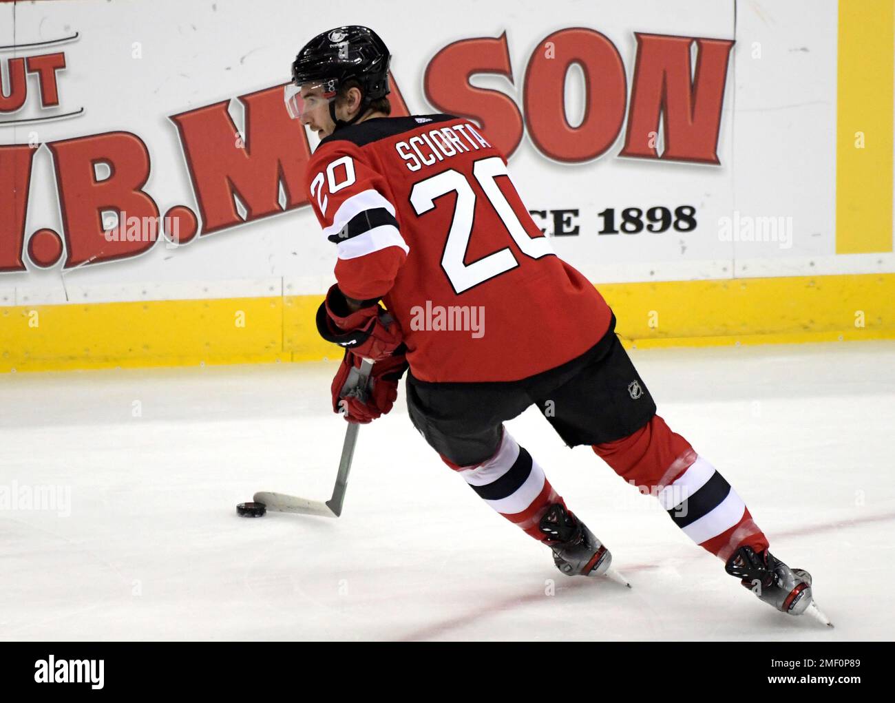 New Jersey Devils center Michael McLeod (20) wears the name of a health ...