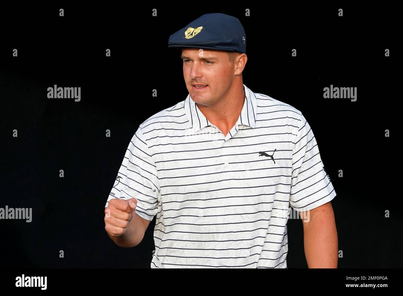 Bryson DeChambeau gestures to a young fan on the 15th hole during the ...