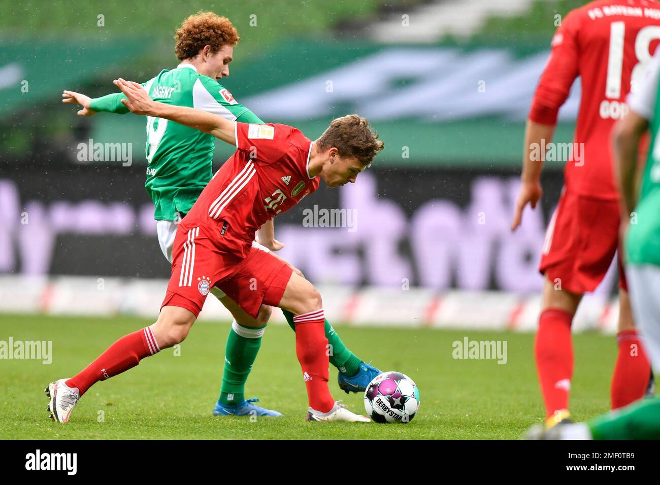 Bayern's Joshua Kimmich vies for the ball with Bremen's Josh Sargent ...