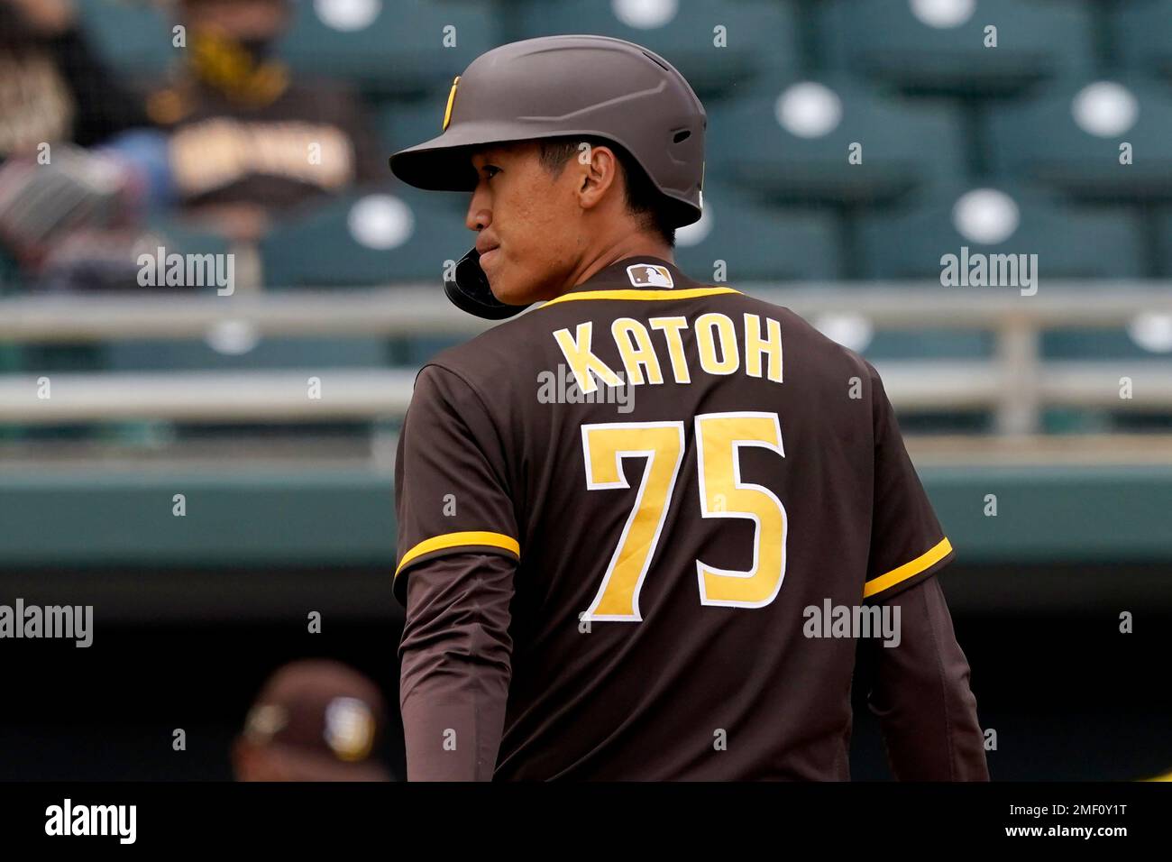 San Diego Padres' Gosuke Katoh looks back to the umpire after striking ...