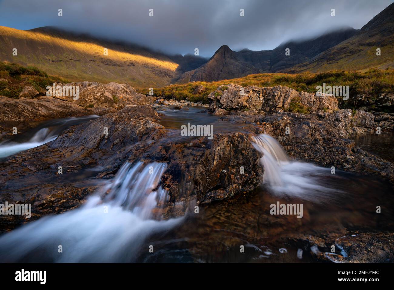 Dramatic sunset light at The Fairy Pools on The Isle of Skye, Scotland ...