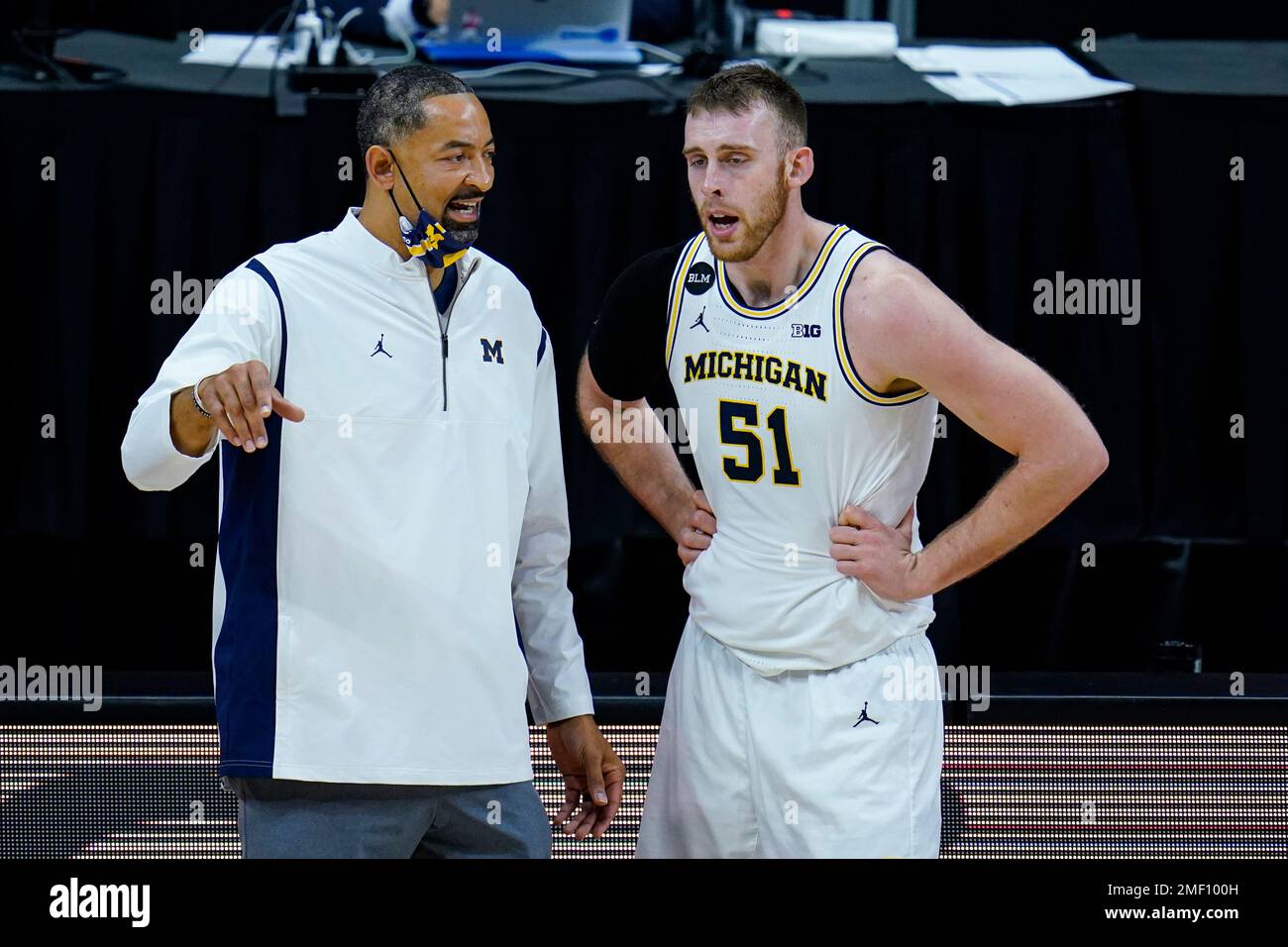 Michigan head coach Juwan Howard talks with Austin Davis as they played ...