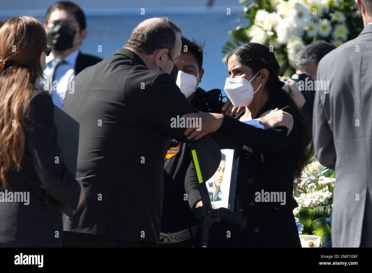 Guatemalan President Alejandro Giammattei gives his condolences to a ...