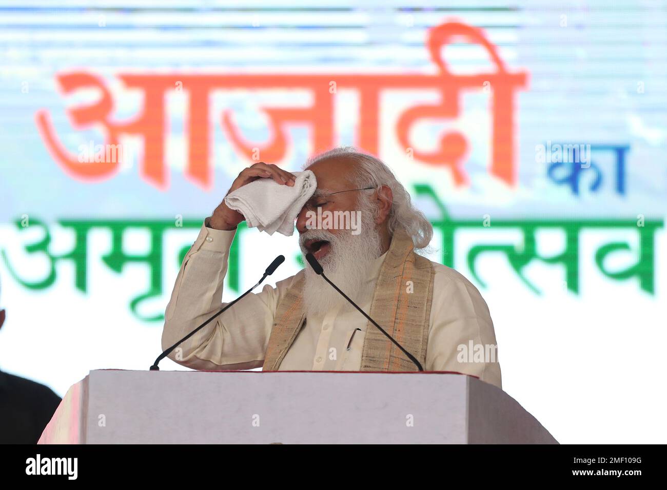 Indian Prime Minister Narendra Modi wipes sweat during inauguration of ...