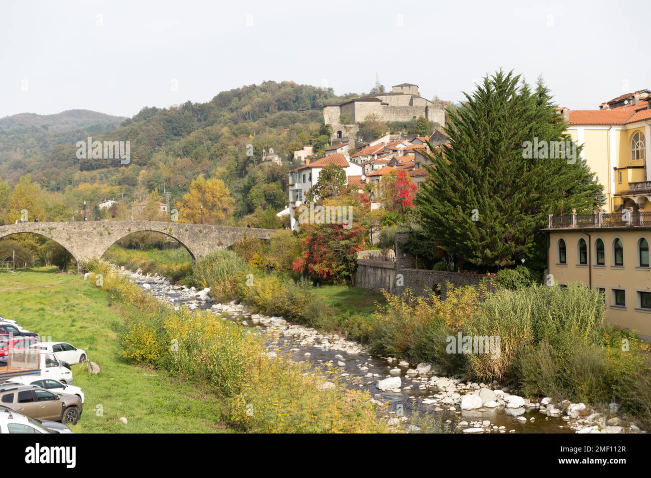View of ancient stone bridge over the Magra River in fall in the ...