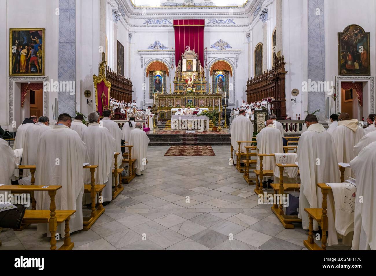 Catholic priests during a service inside the church Piazza Armerina ...