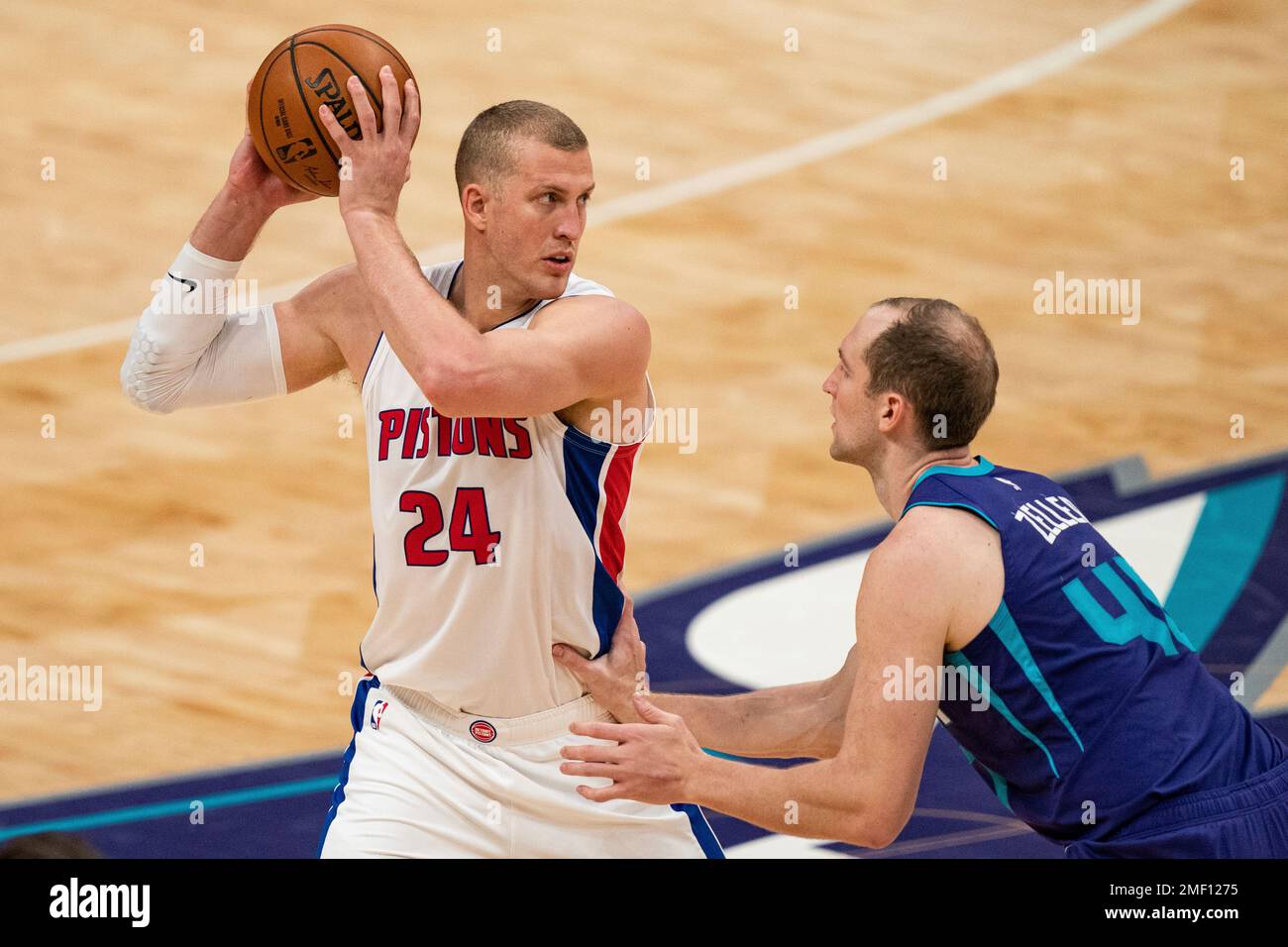 Detroit Pistons center Mason Plumlee (24) is guarded by Charlotte ...