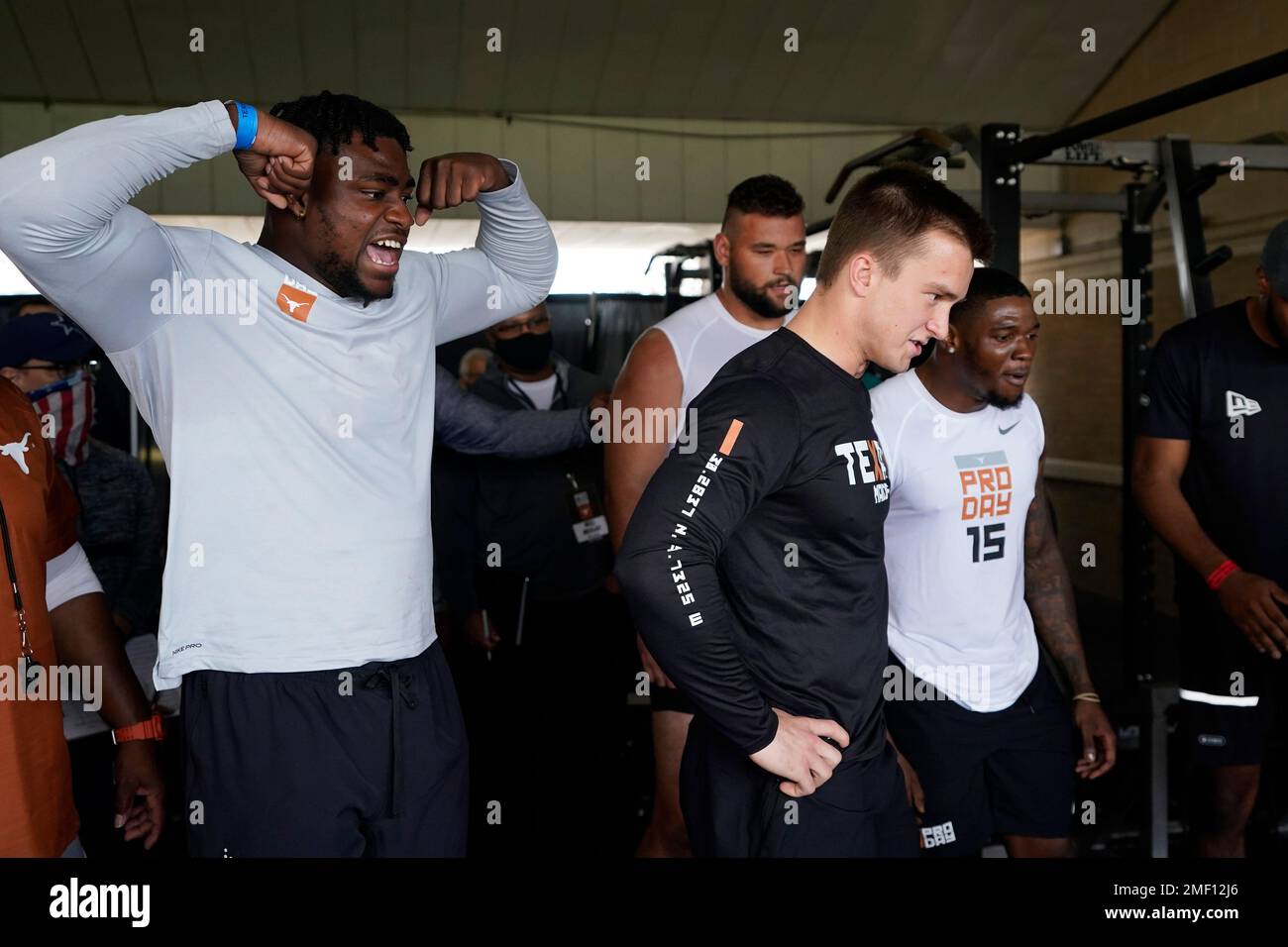 Texas linebacker Joseph Ossai, left, cheers on teammates during the ...