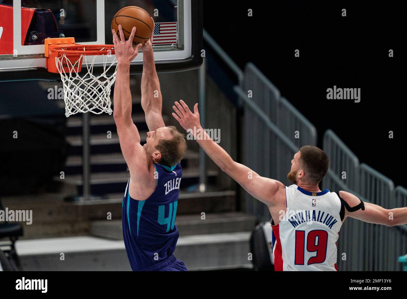 Charlotte Hornets center Cody Zeller (40) dunks while guarded by ...