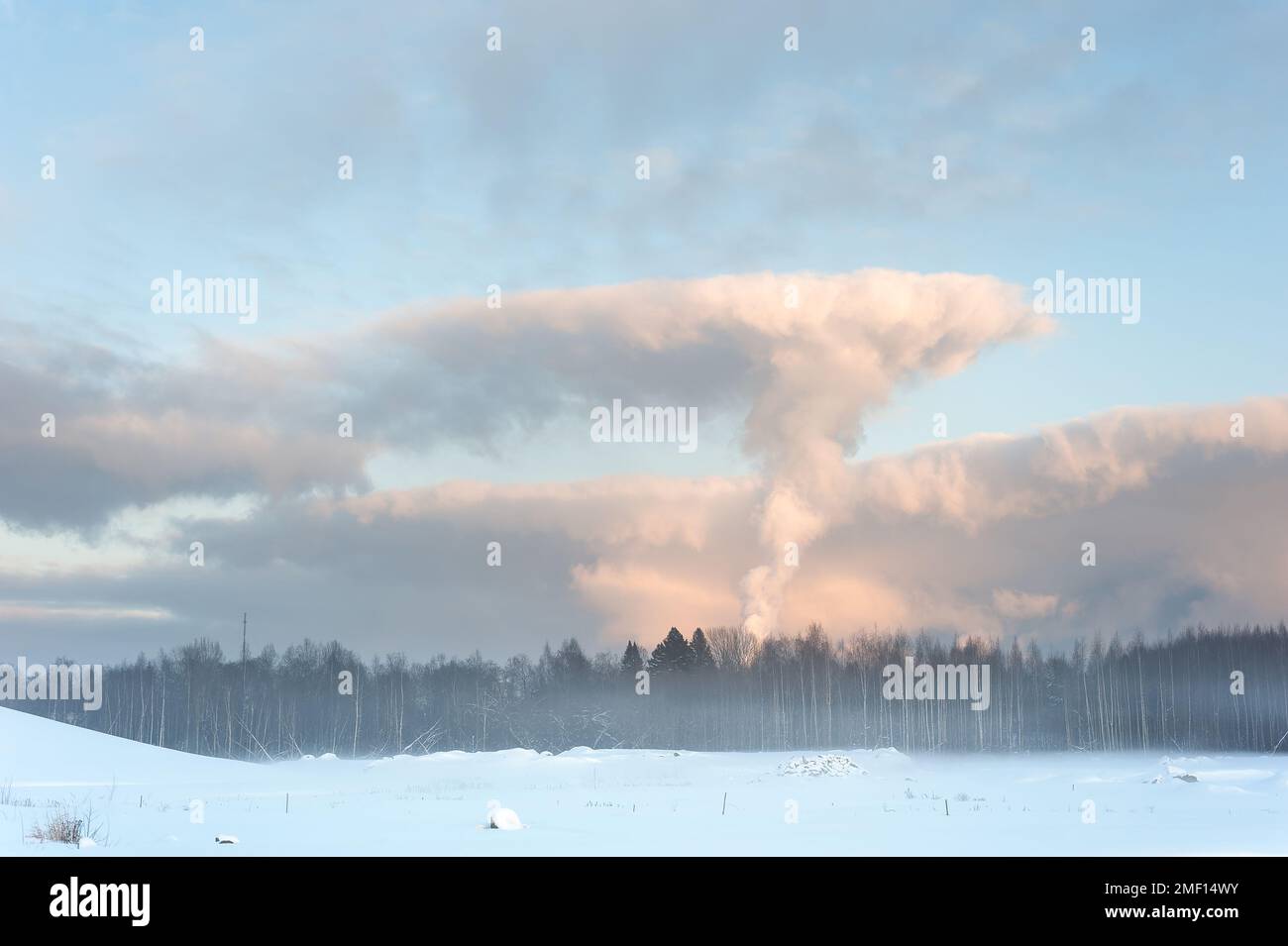 Temperature inversion. On a very cold winter day smoke rising from ...