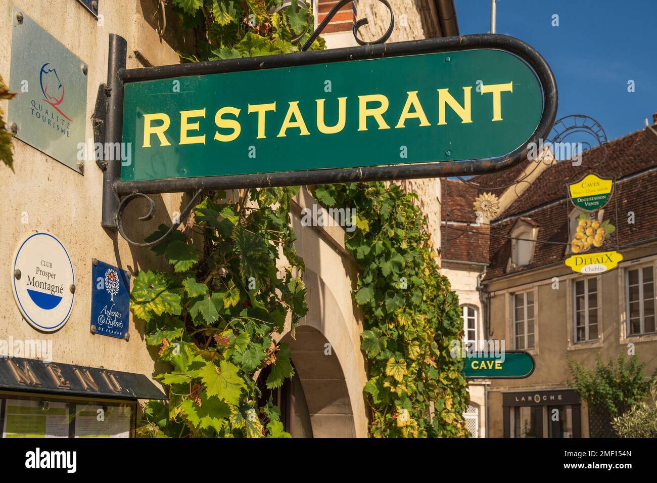 The restaurant sign of the Caveau Defaix Daniel Étienne at the 14, rue ...