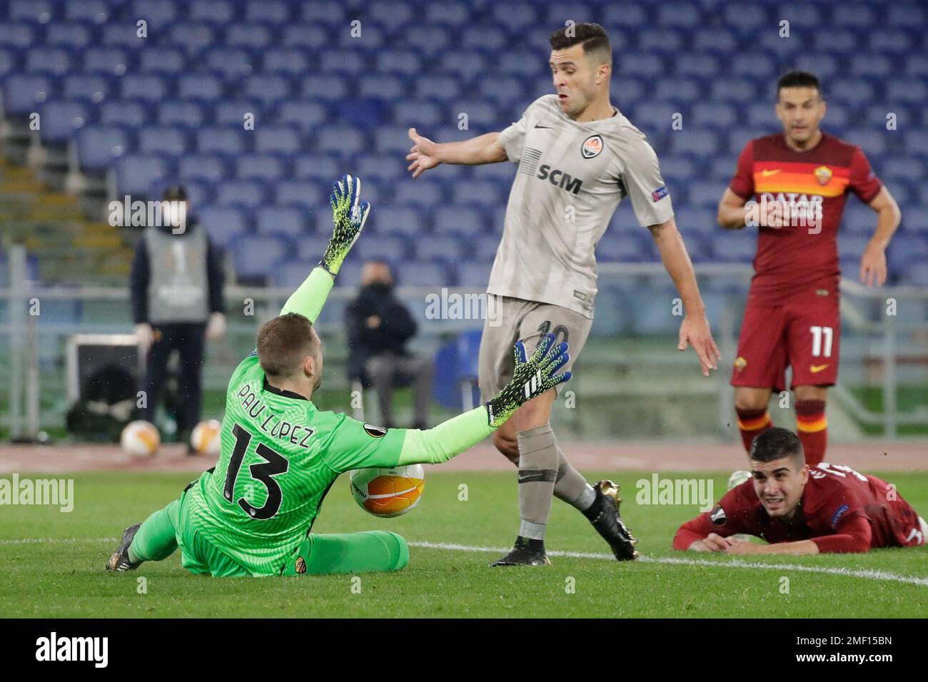 Roma's goalkeeper Pau Lopez, left, saves on Shakhtar's Junior Moraes ...