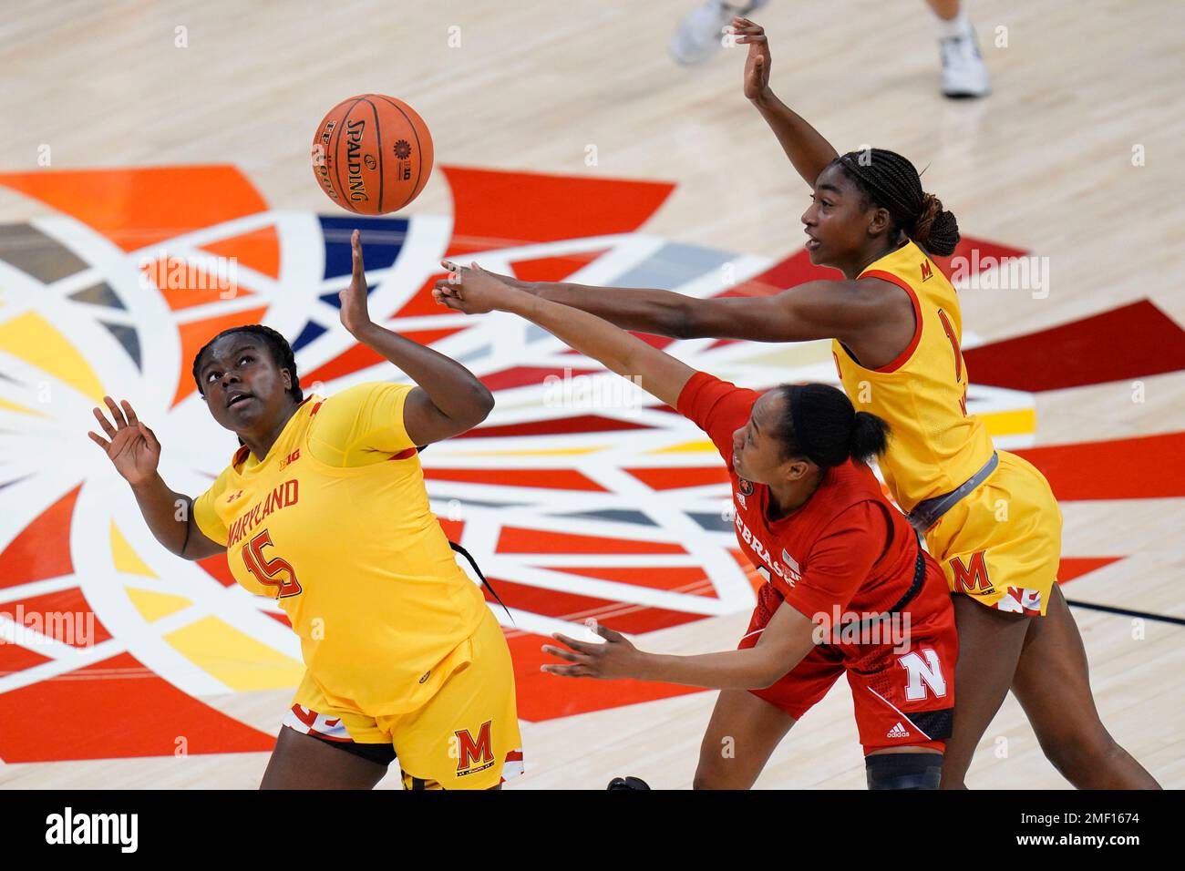 Maryland's Ashley Owusu, left, and Diamond Miller, right, go after a ...