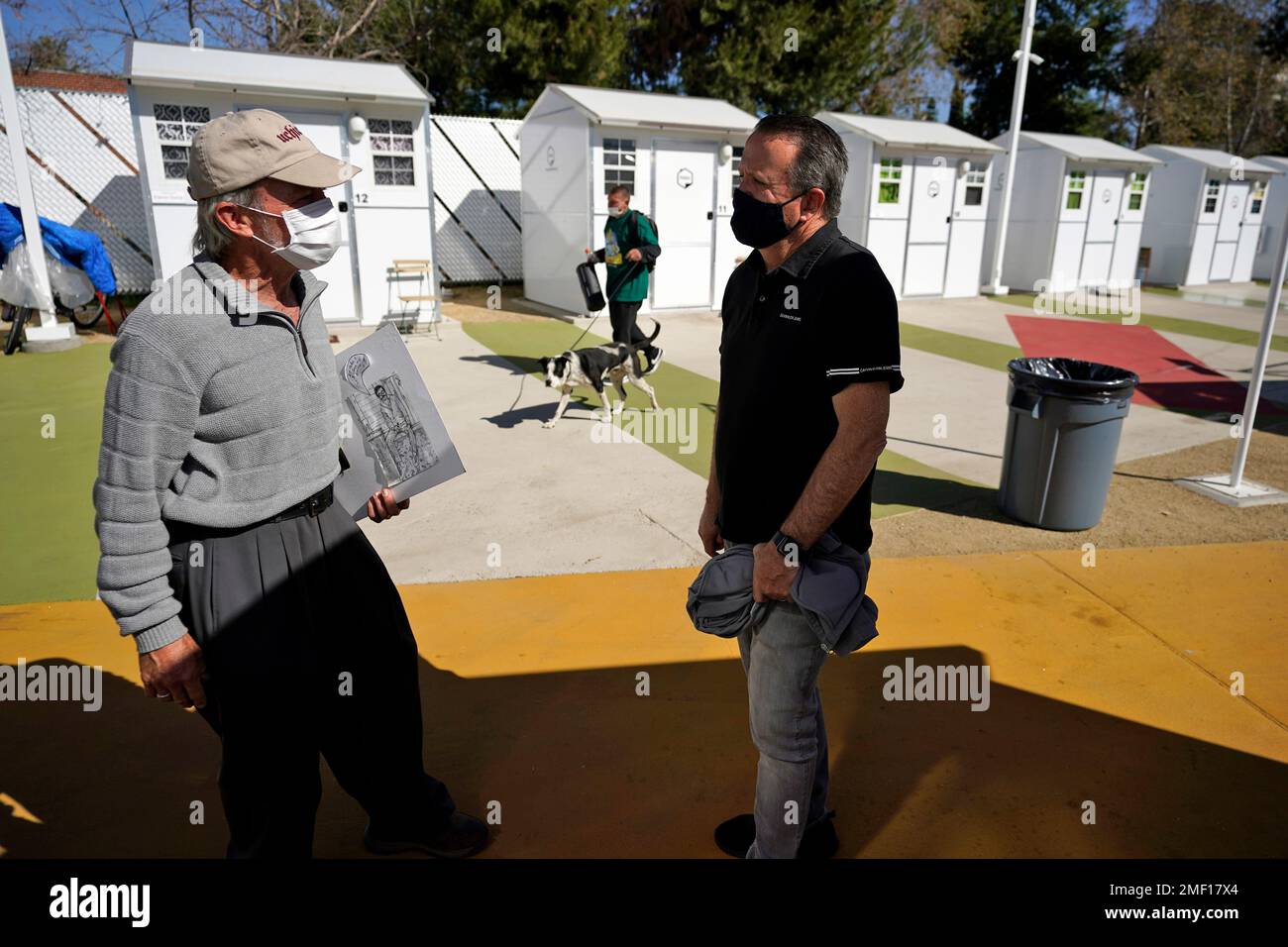 Hope of the Valley CEO Ken Craft, right, talks to resident Ted ...