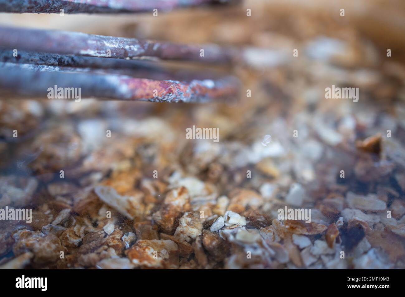 rusty metal texture. rusted heater surrounded by scale. focus on rust ...