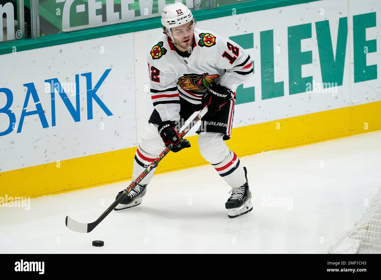 Chicago Blackhawks' Alex DeBrincat controls the puck during an NHL ...