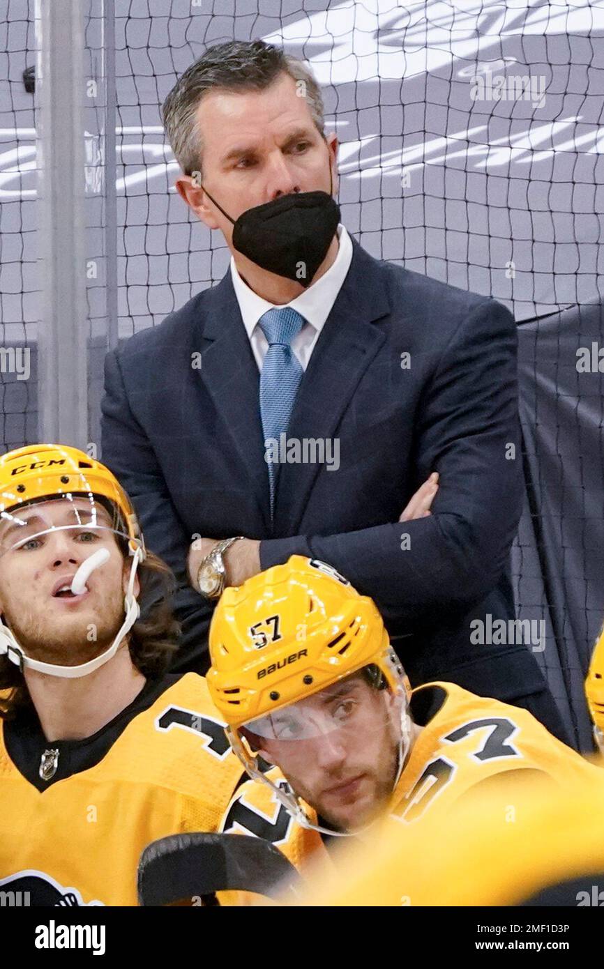 Pittsburgh Penguins head coach Mike Sullivan works with his team from ...