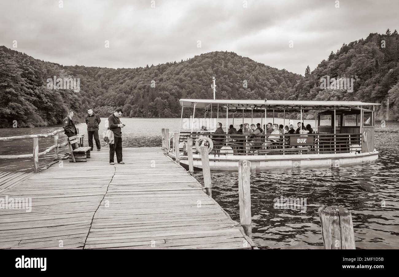 Ride electric boat across Lake Kocjak at pier in Plitvice Lakes ...