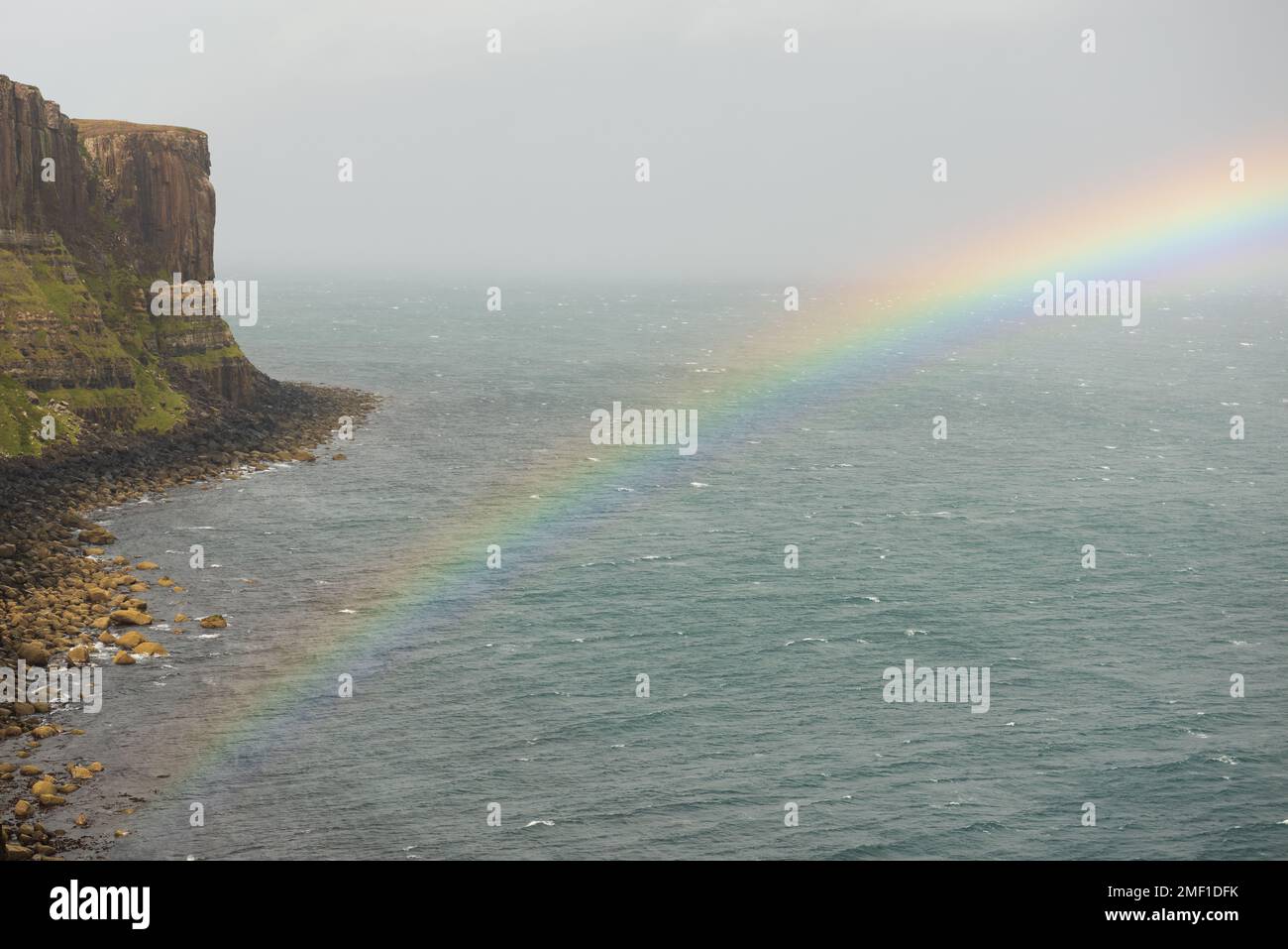 Looking out to dramatic weather on Scottish coast with beautiful ...