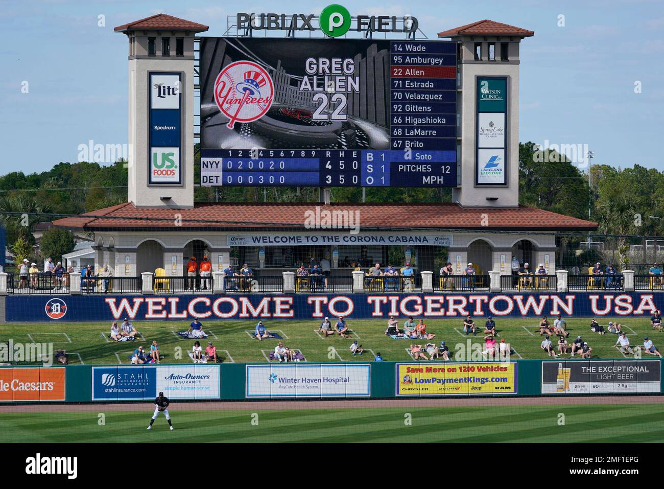 Socially distanced baseball fans watch a spring training exhibition ...