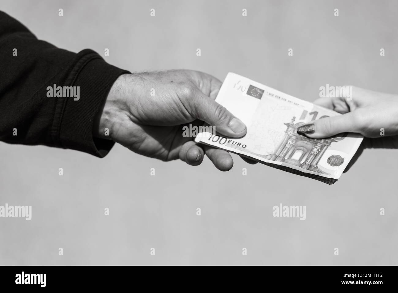 Hand giving money like bribe or tips or salary isolated, hard worked ...