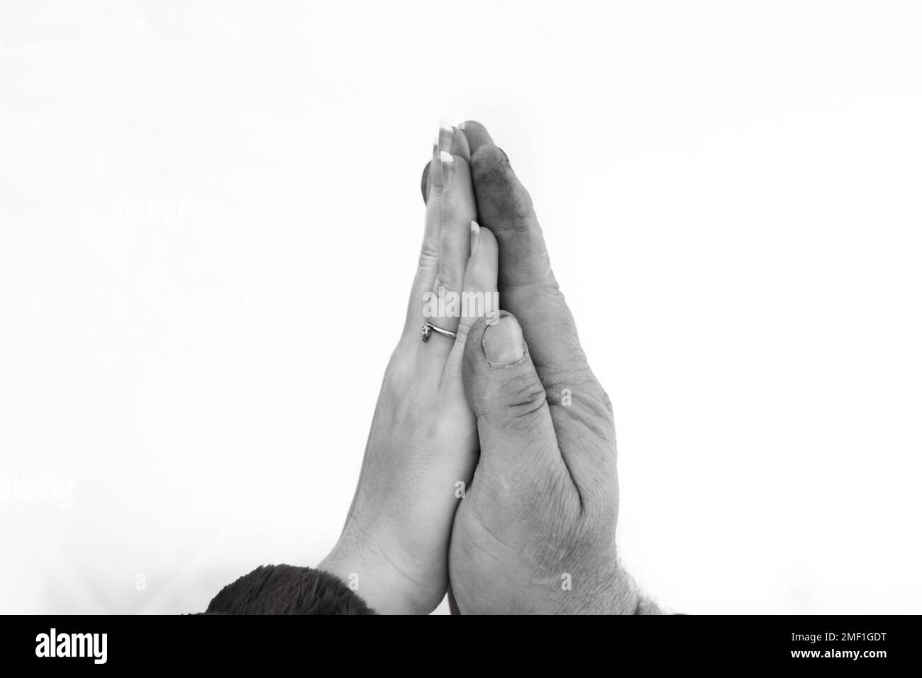 Touching hands, father with hard worked hand giving high five with his ...