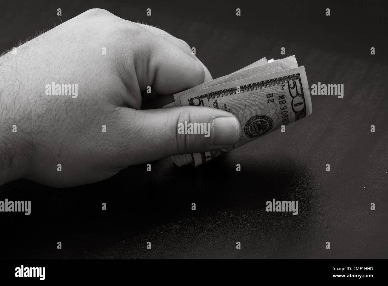 Man counting money, counting dollars close up Stock Photo - Alamy