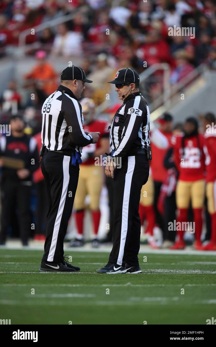 Back judge Brad Freeman (88) and umpire Bryan Neale (92) on the field ...