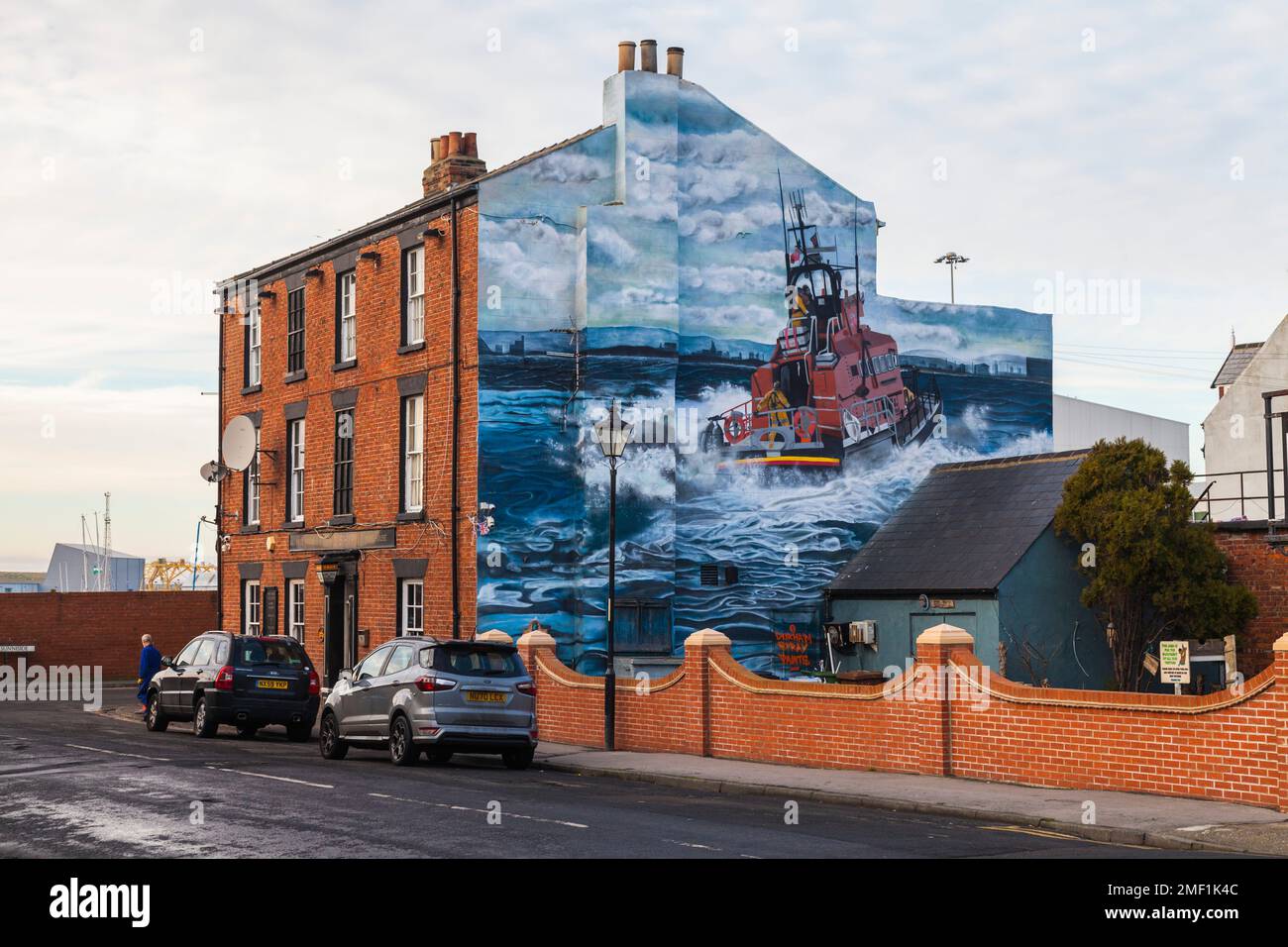A stunning mural of a lifeboat at sea on the wall of the Ship Inn pub ...