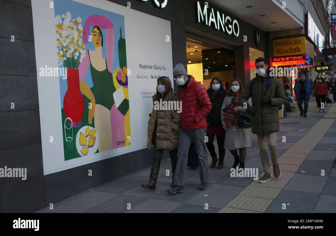 People walk past a poster of a painting by Mexico City-based artist Ana ...