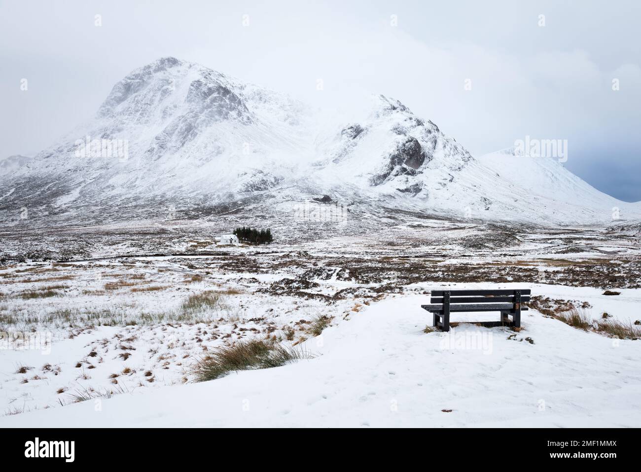 Winter afternoon view of wooden bench looking over Glencoe with snow ...