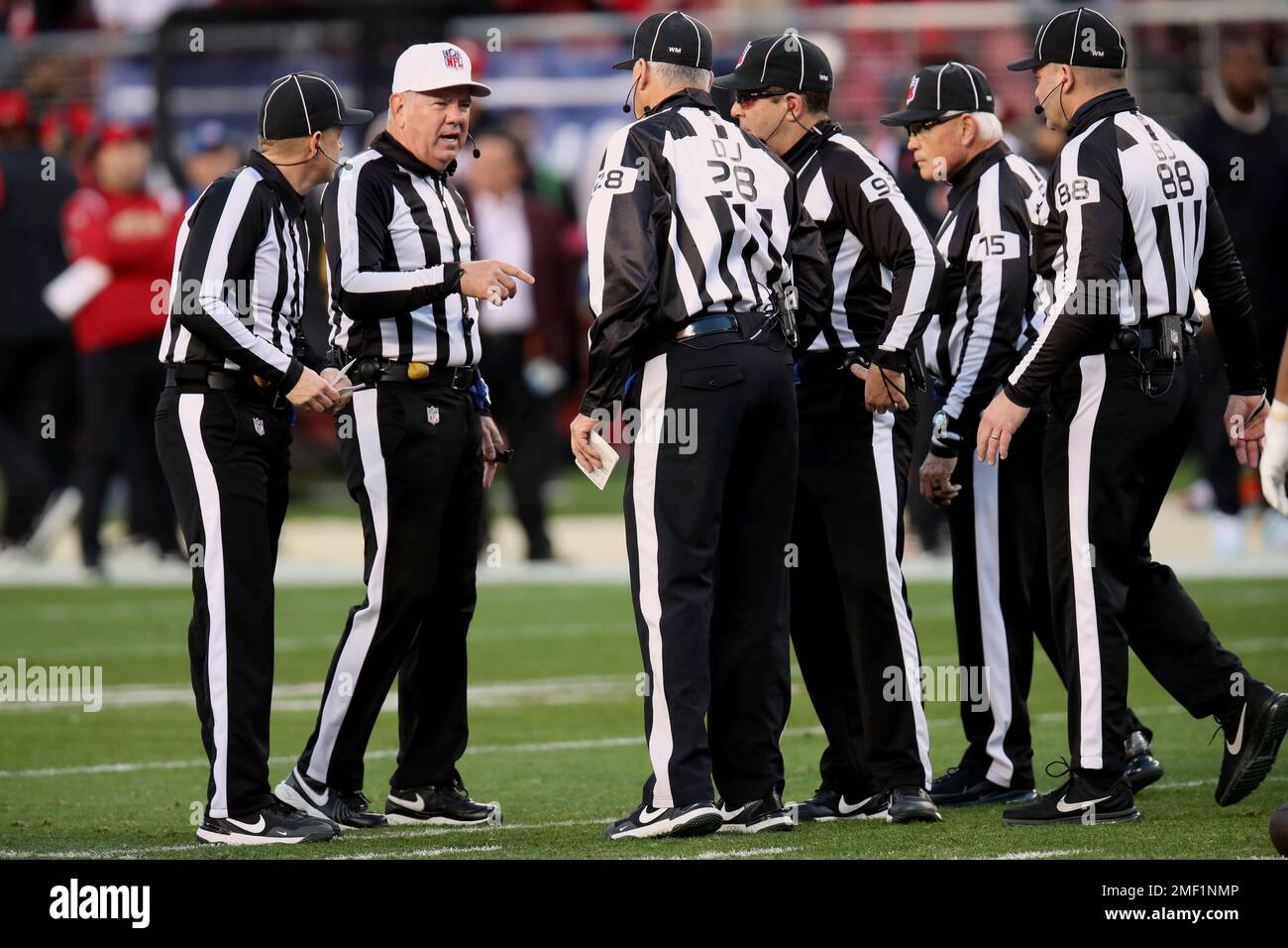 Referee Bill Vinovich (52) talks to his crew during an NFL divisional ...
