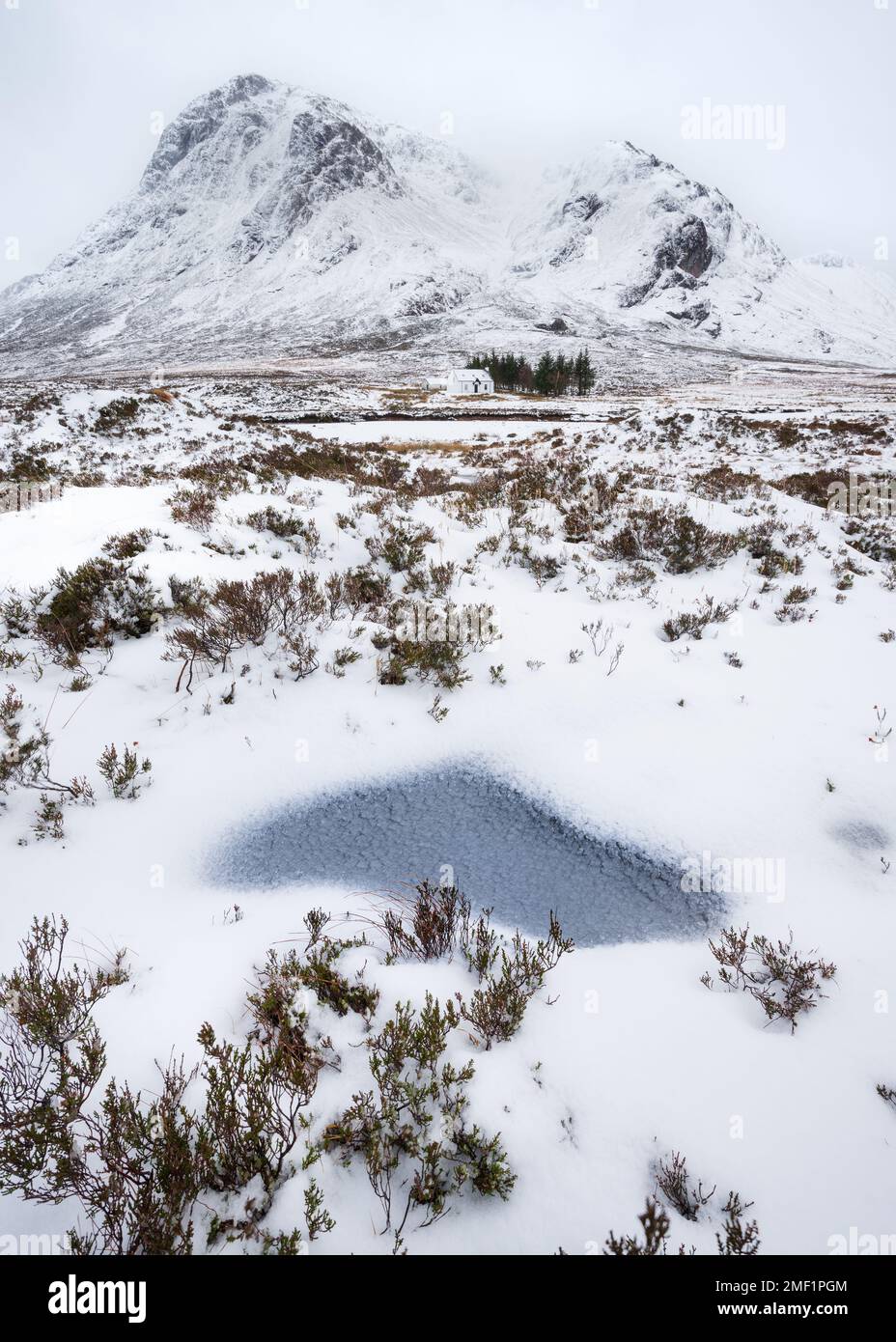 Beautiful snow covered landscape with frozen puddle and view towards ...