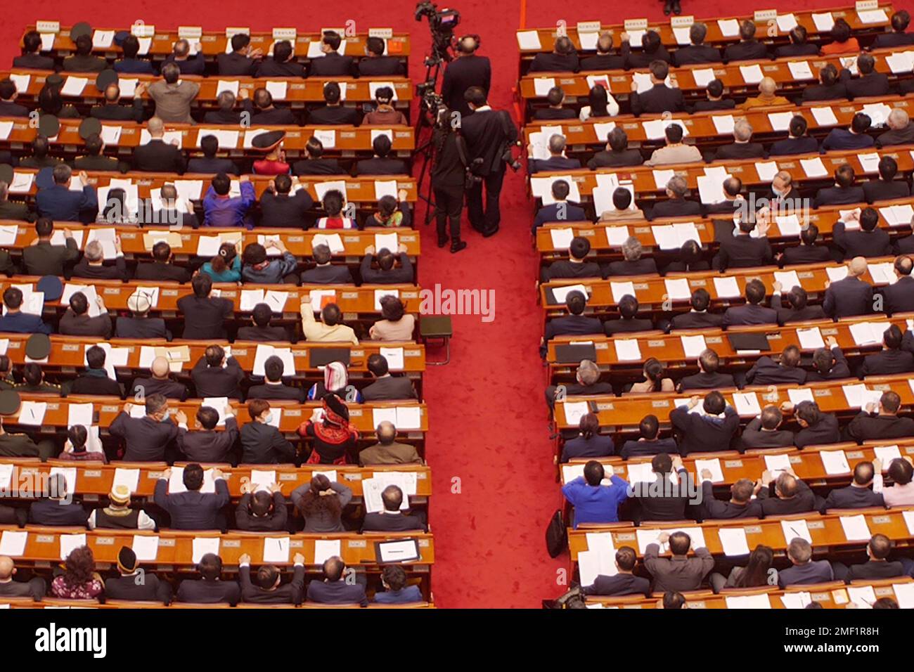 Delegates attend a plenary session of China's National People's ...