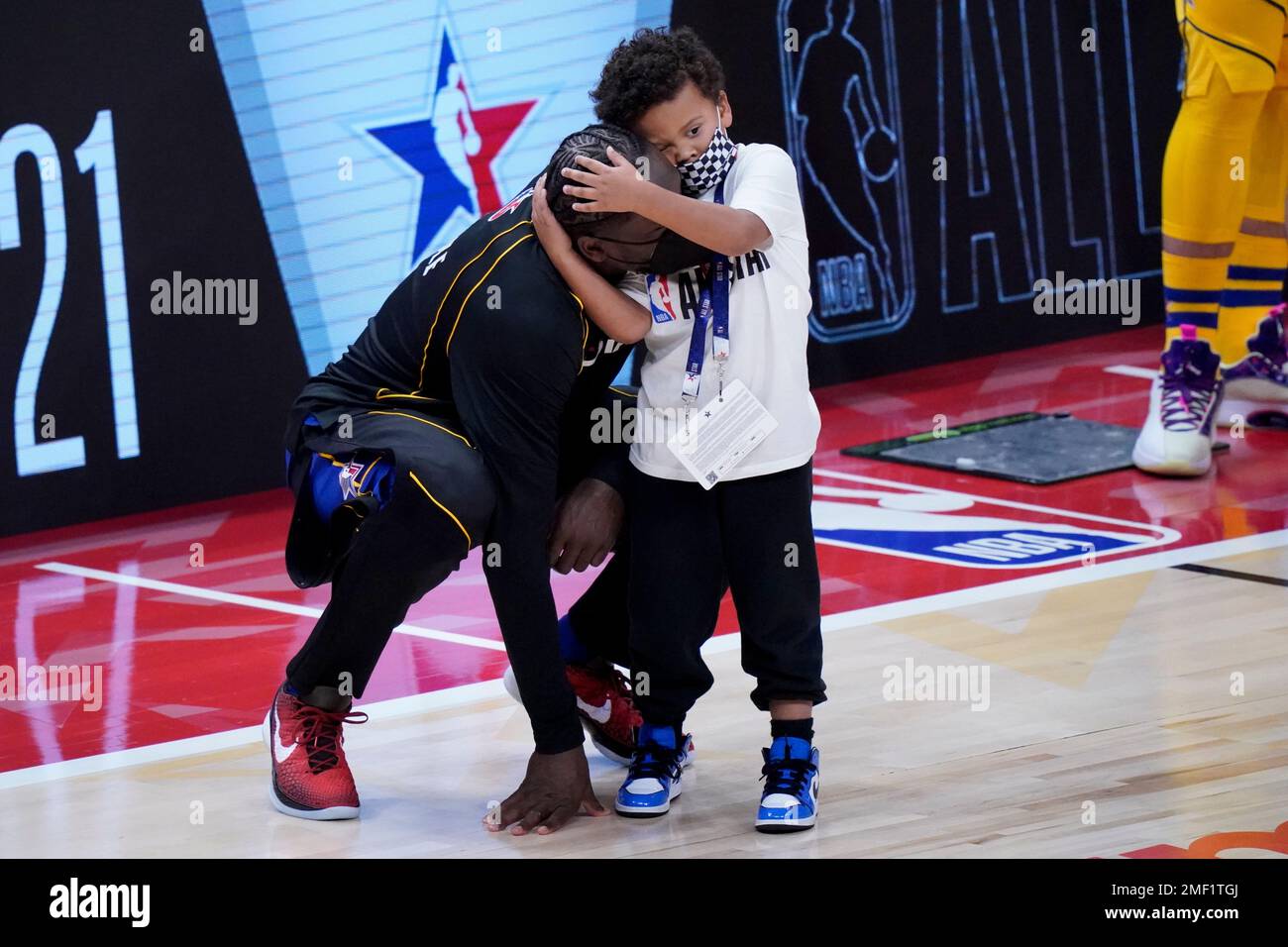 New York Knicks center Julius Randle gets a hug from his son Kyden ...