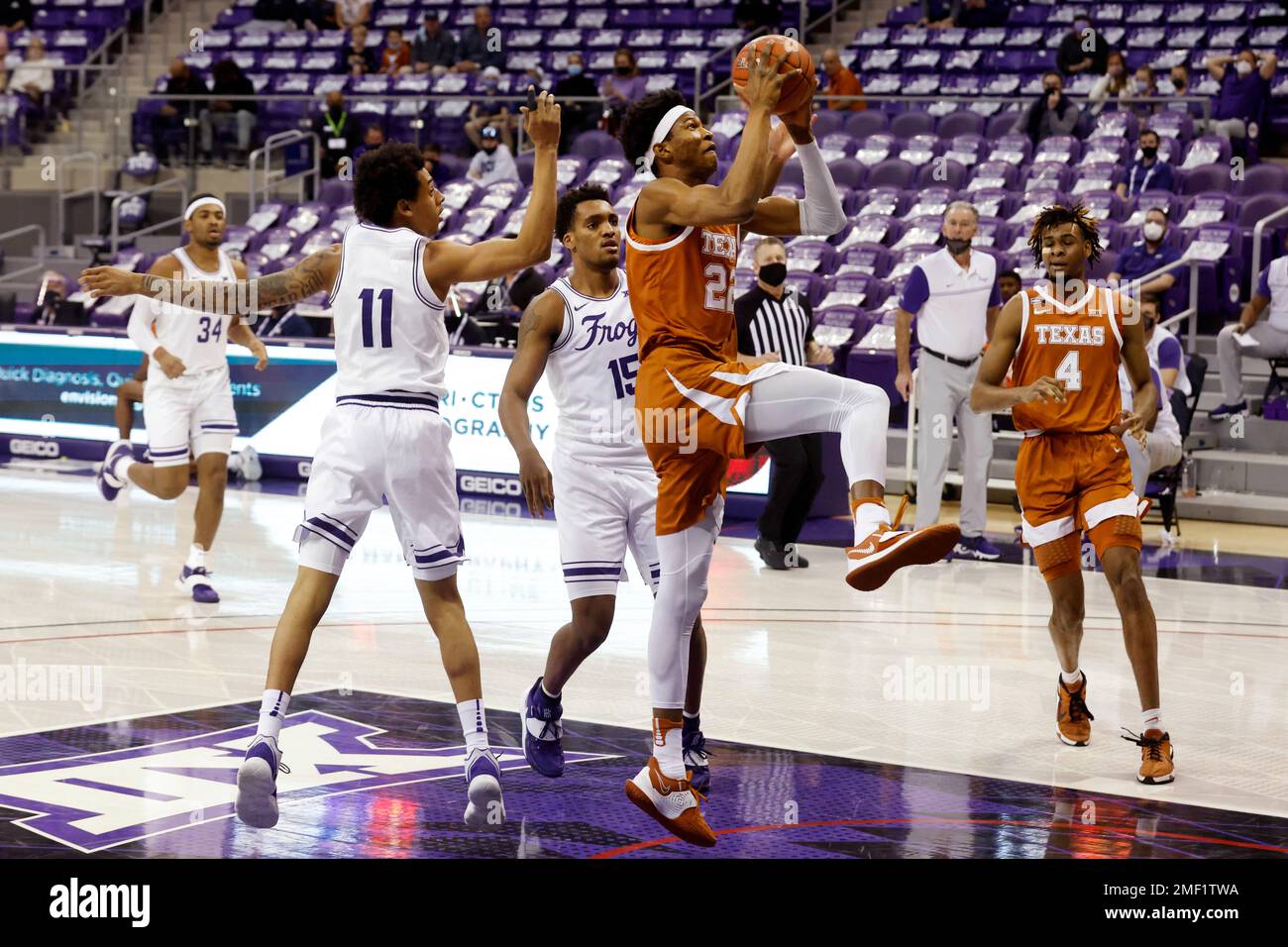 Texas forward Kai Jones (22) drives to the basket as TCU guard Taryn ...