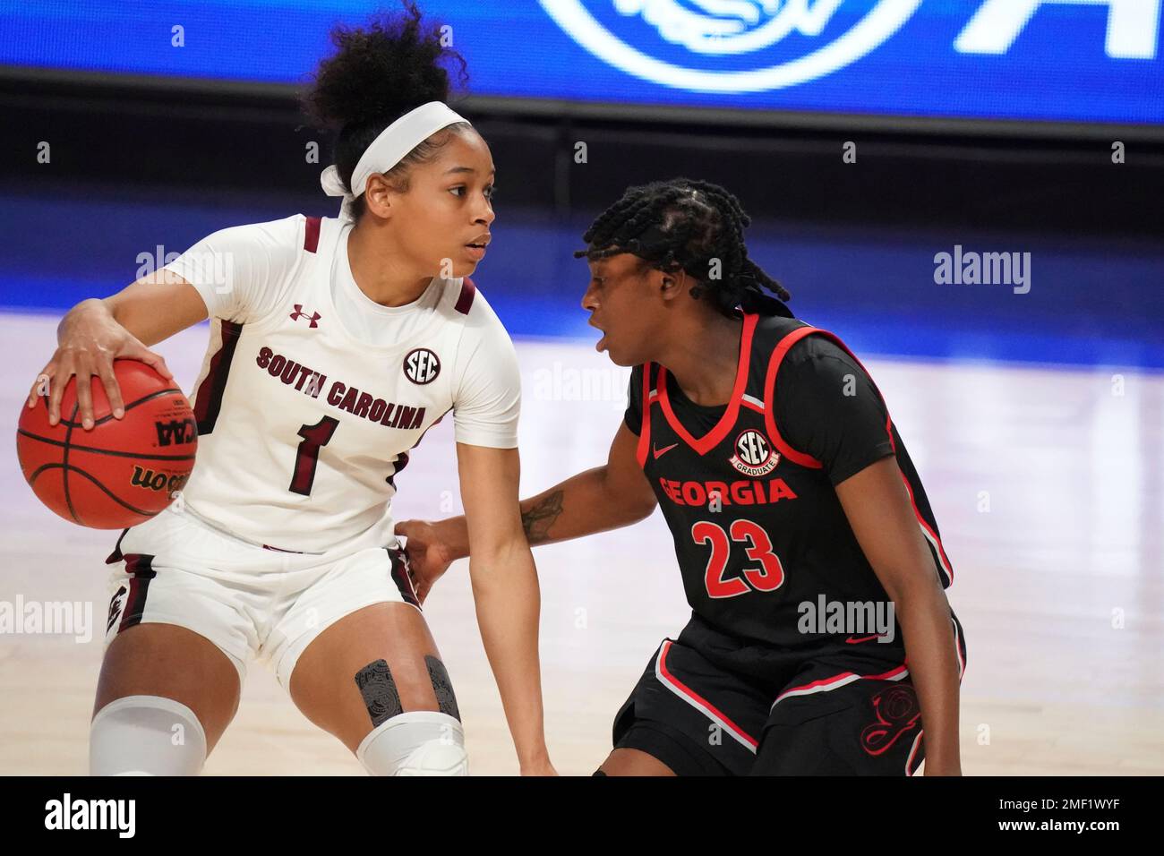 South Carolina guard Zia Cooke (1) dribbles next to Georgia guard Que ...