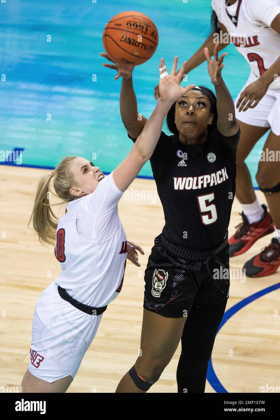 North Carolina State's Jada Boyd, right, and Louisville's Hailey Van ...