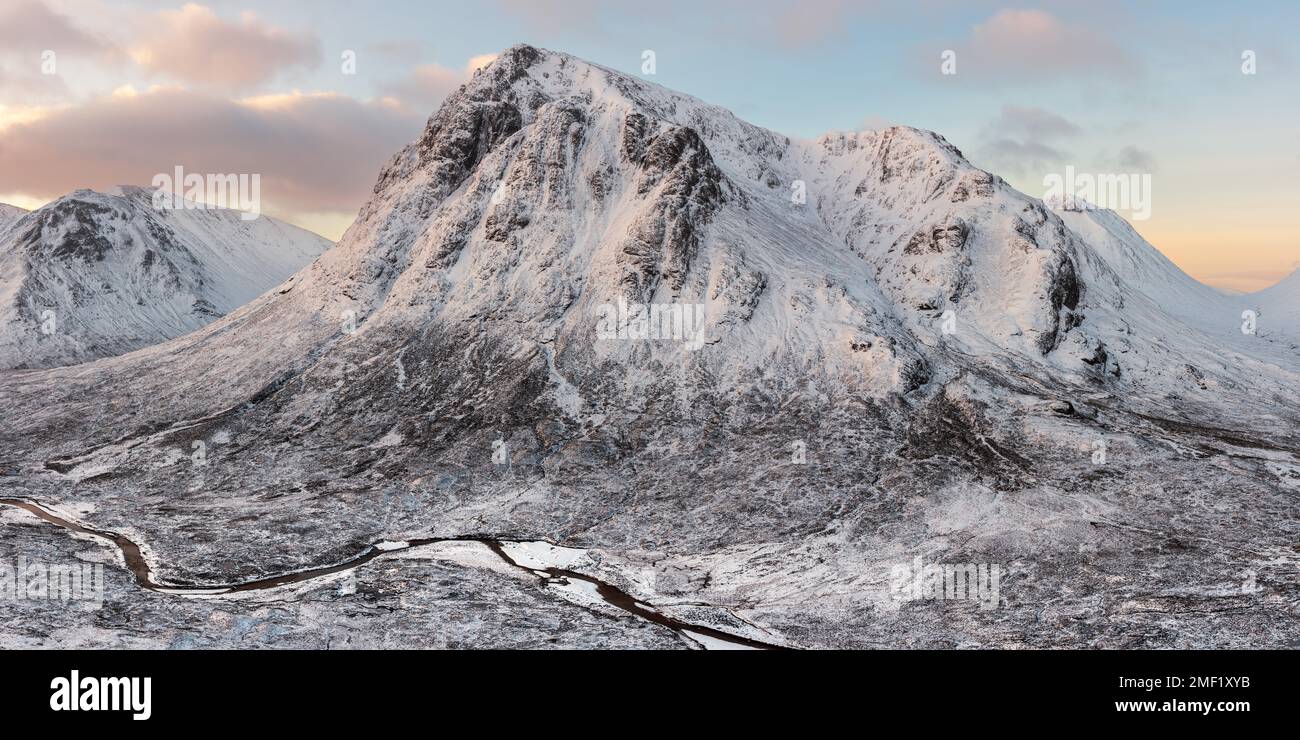 Dramatic panoramic view of iconic snow covered mountain Buachaille ...
