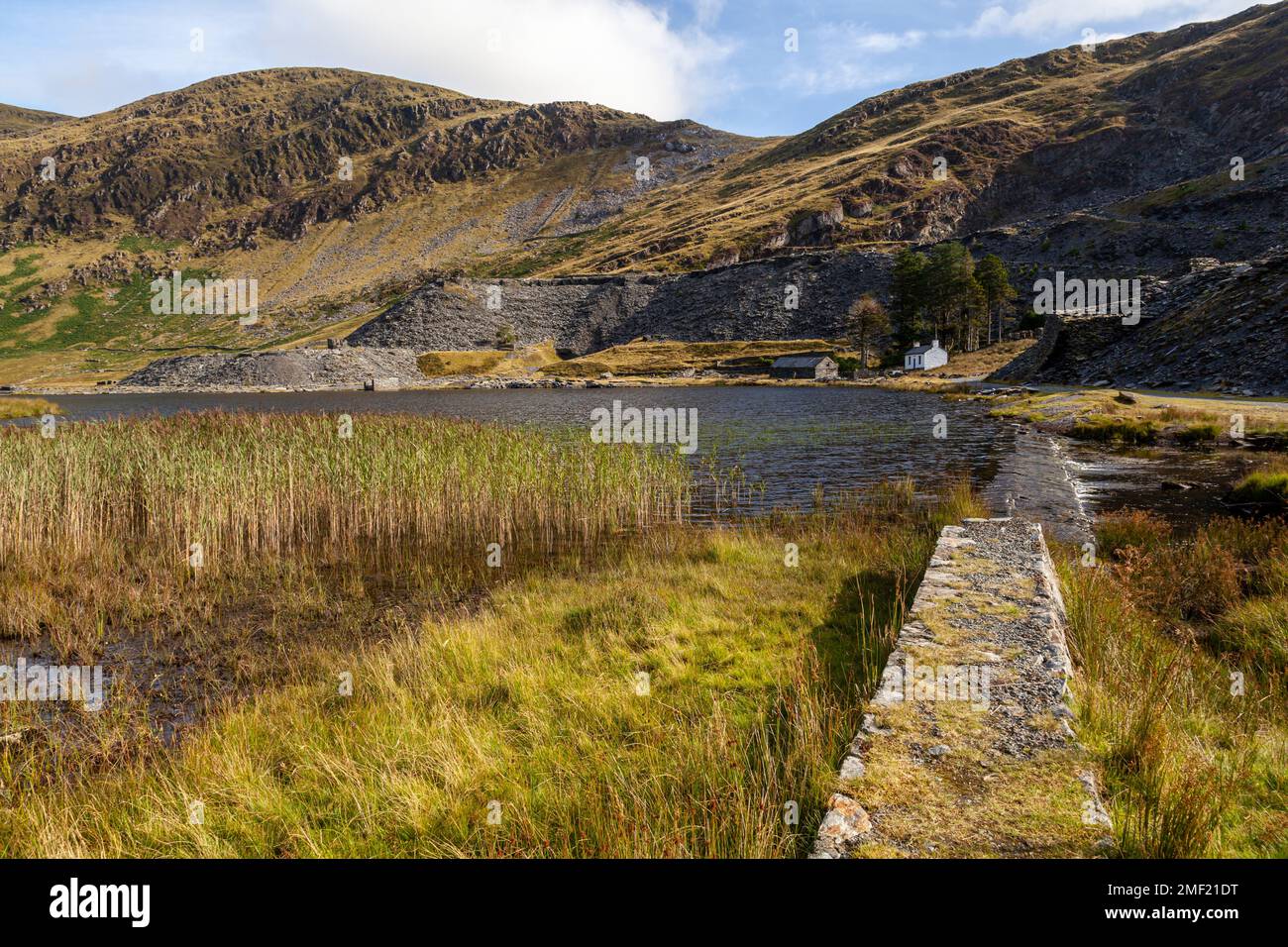 Looking across the weir of Llyn Cwmorthin towards the disused slate ...