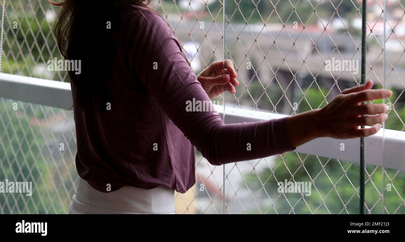 Person sliding balcony window sideways woman opens glass window Stock ...