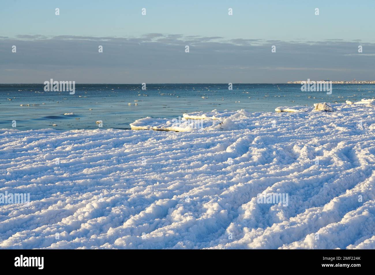 Ice formation on the coast of the Baltic Sea, water waves turning into ...