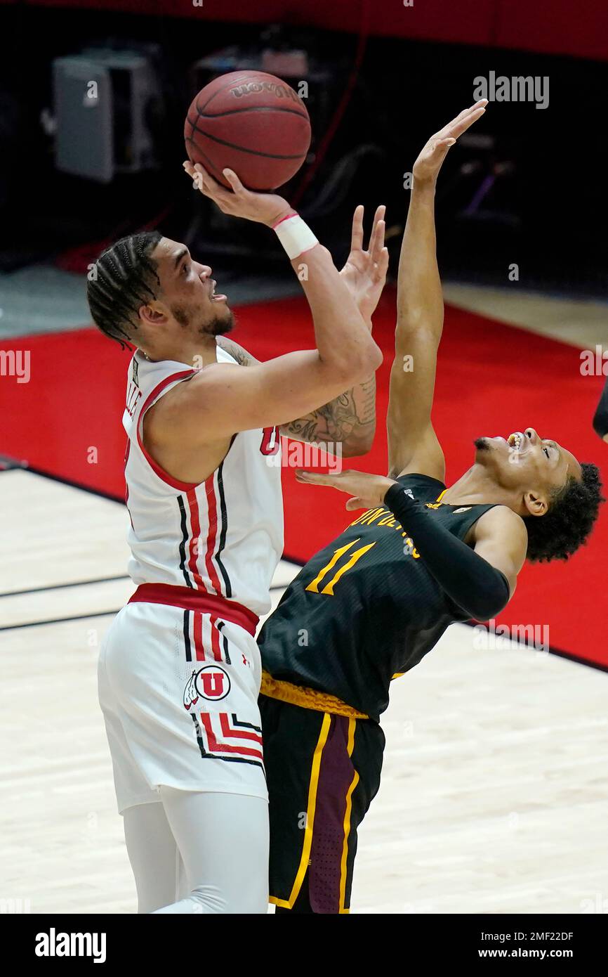 Utah forward Timmy Allen, left, shoots as Arizona State guard Alonzo ...