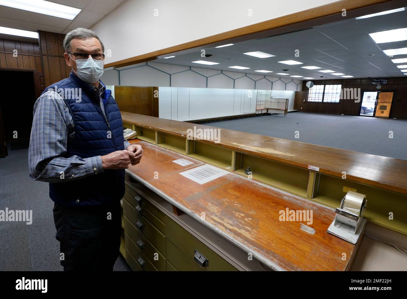 Retired pharmacist, Russell Alan Garner stands behind the counter in ...